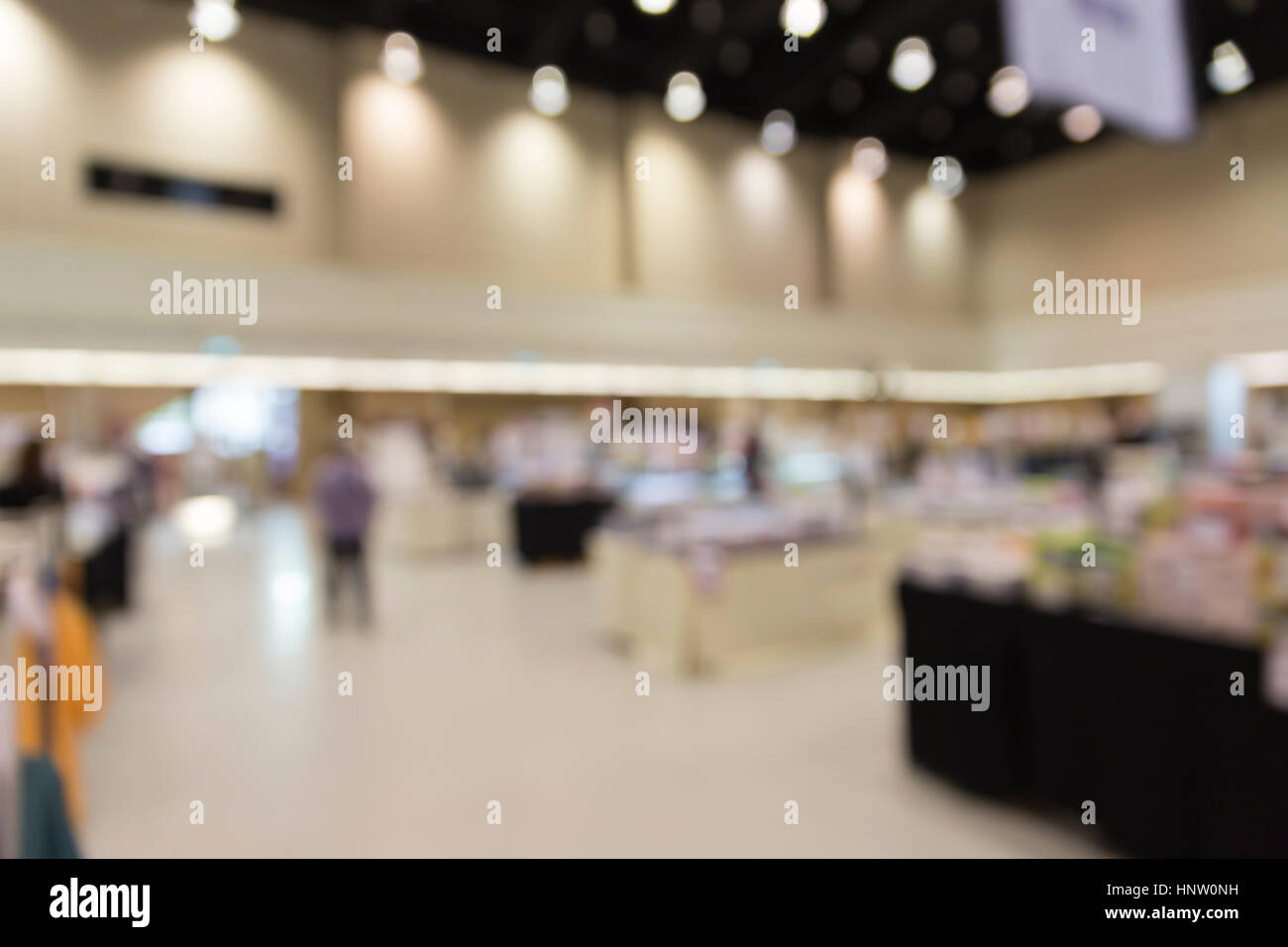 clothing selling in department store for use as shopping concept, blur ...