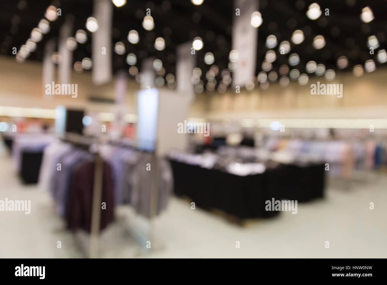 clothing selling in department store for use as shopping concept, blur ...