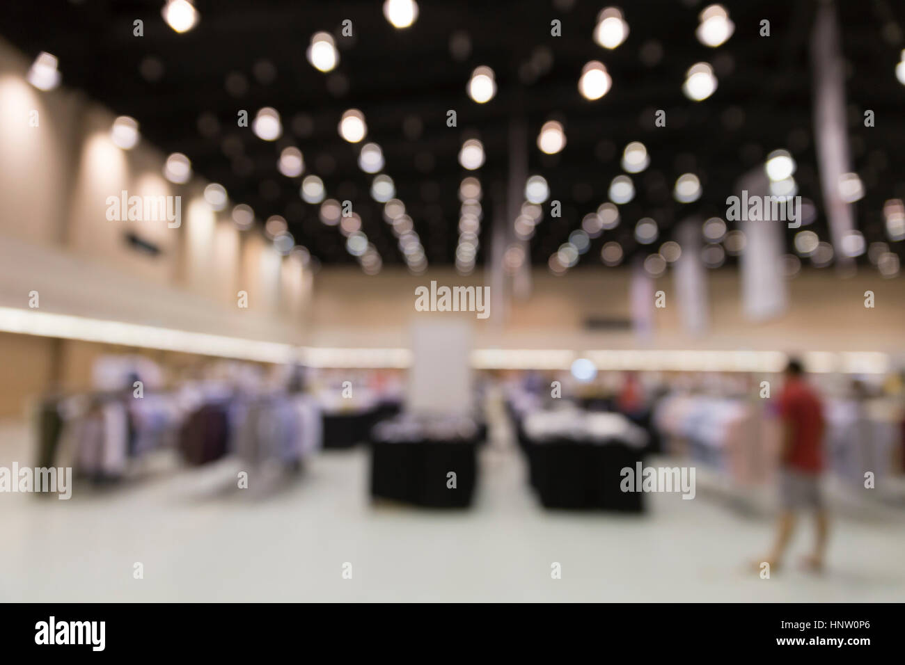 clothing selling in department store for use as shopping concept, blur ...
