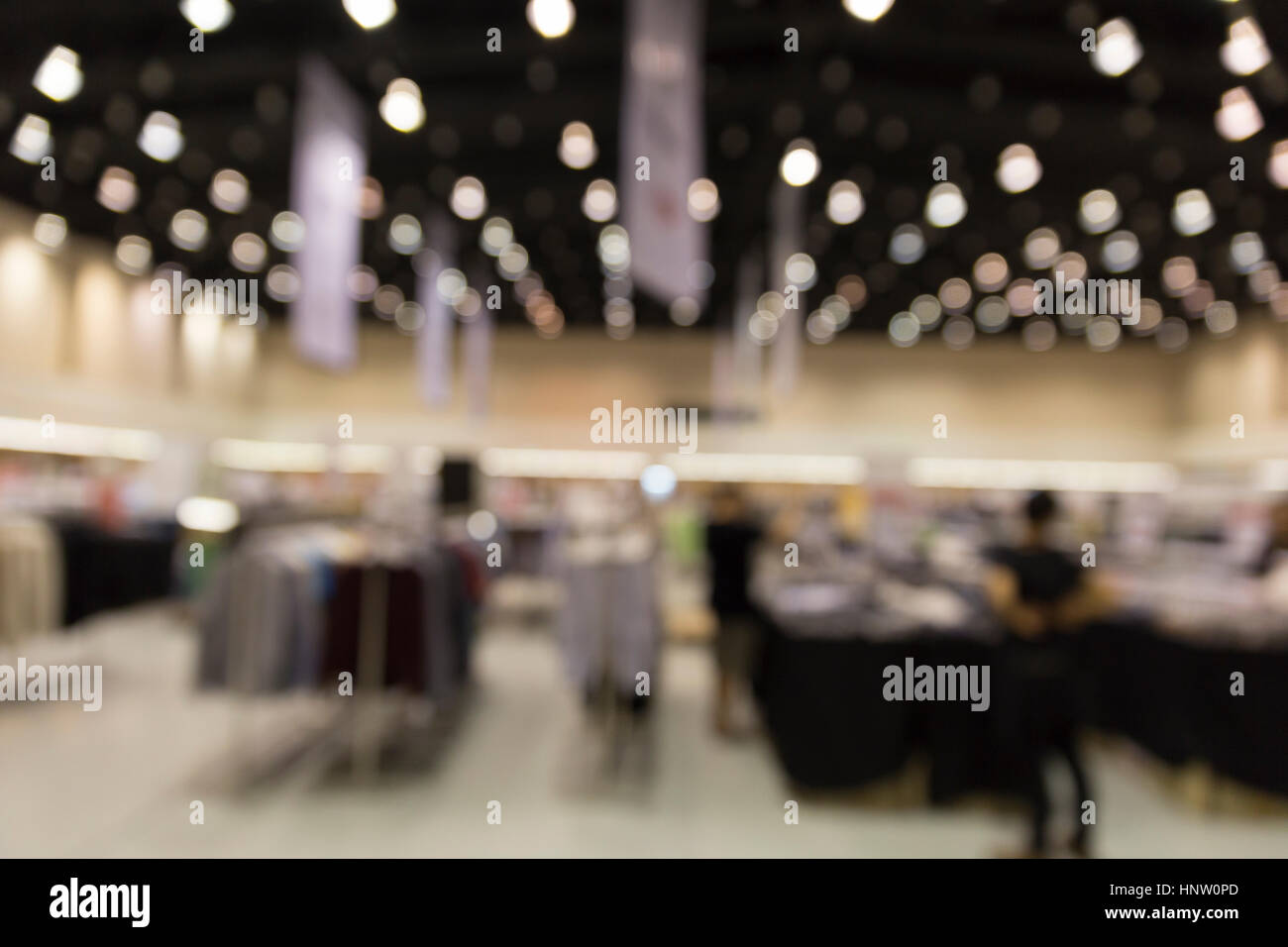 clothing selling in department store for use as shopping concept, blur ...