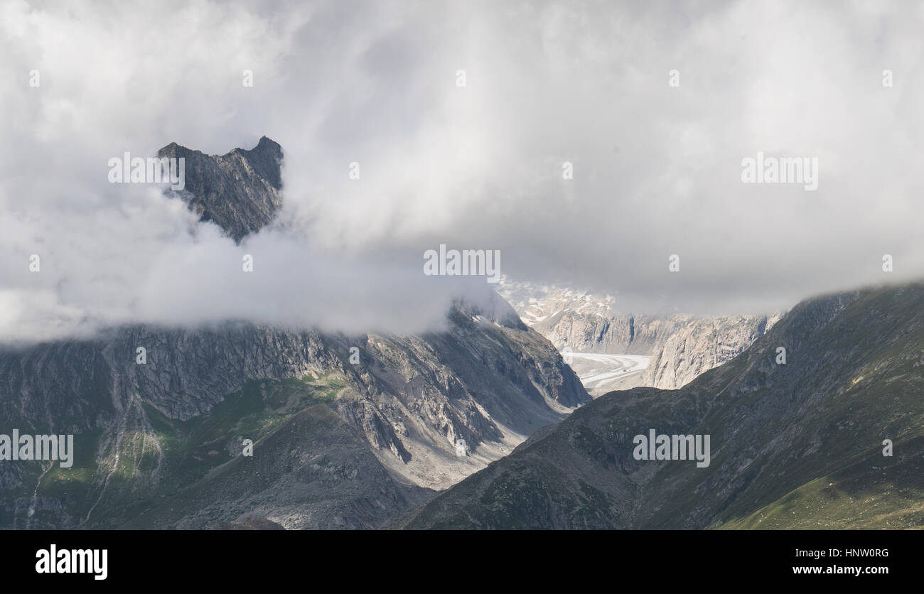 Clouds in remote mountain landscape Stock Photo - Alamy