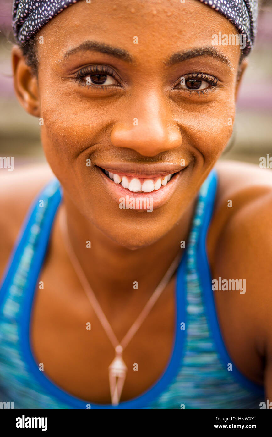 Smiling Black woman sweating Stock Photo - Alamy