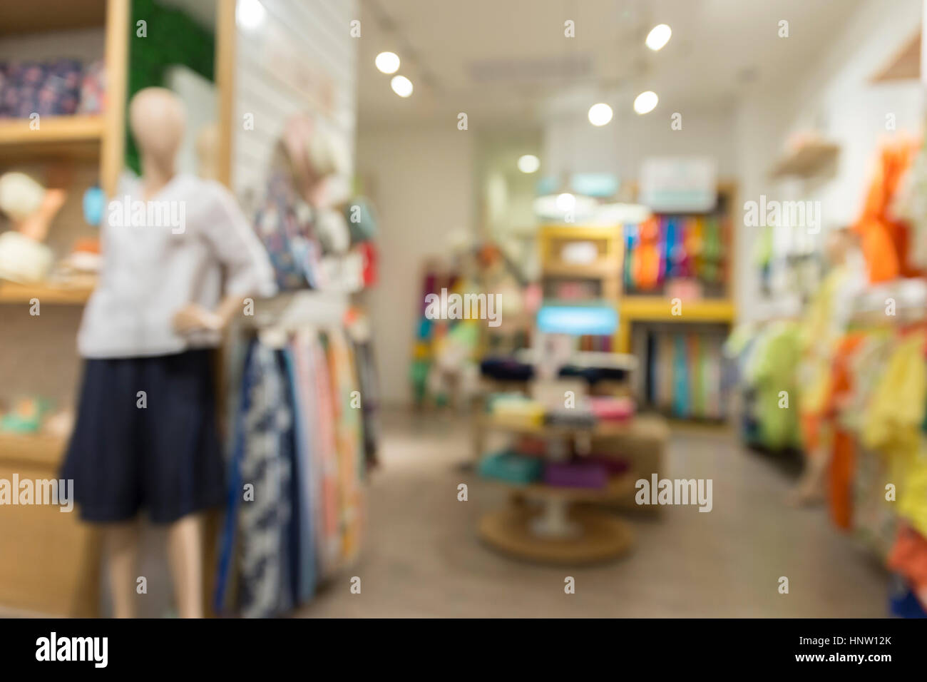 clothing selling in department store for use as shopping concept, blur ...