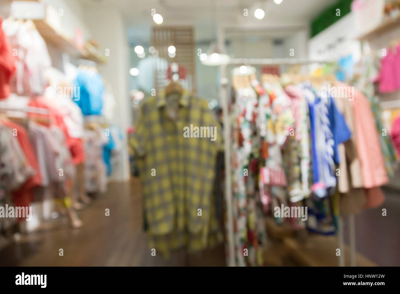 clothing selling in department store for use as shopping concept, blur ...