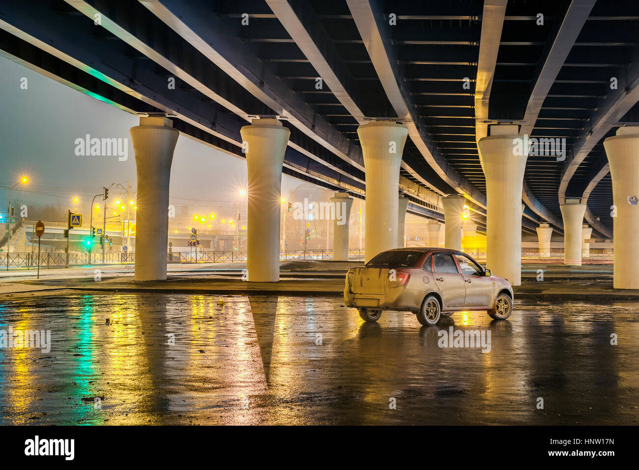 dirty red car on a parking under the bridge at night Stock Photo - Alamy
