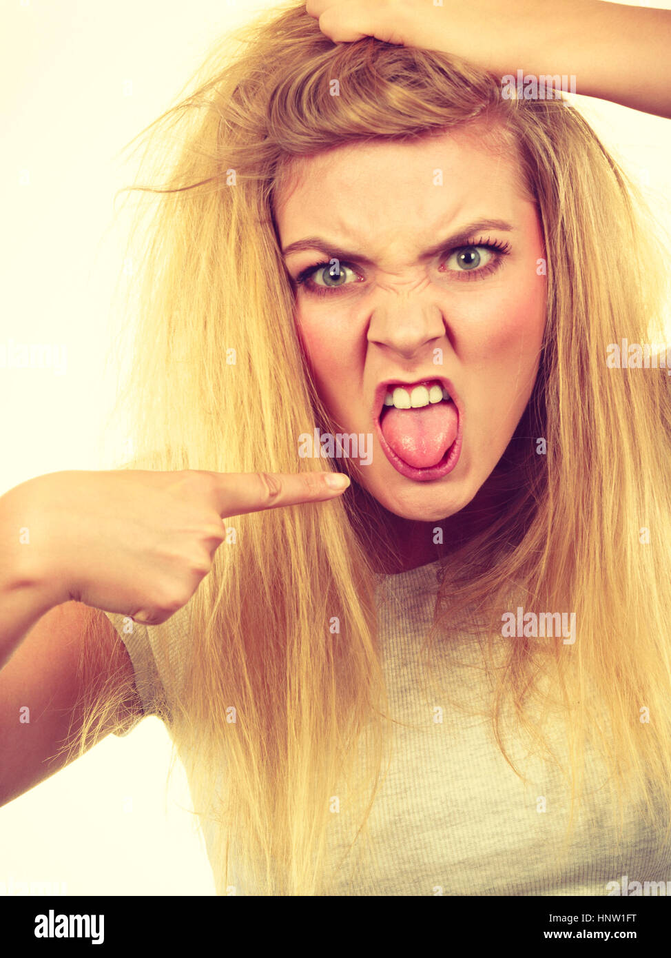 Emotions, face expression concept. Furiously mad hungry blonde woman ...
