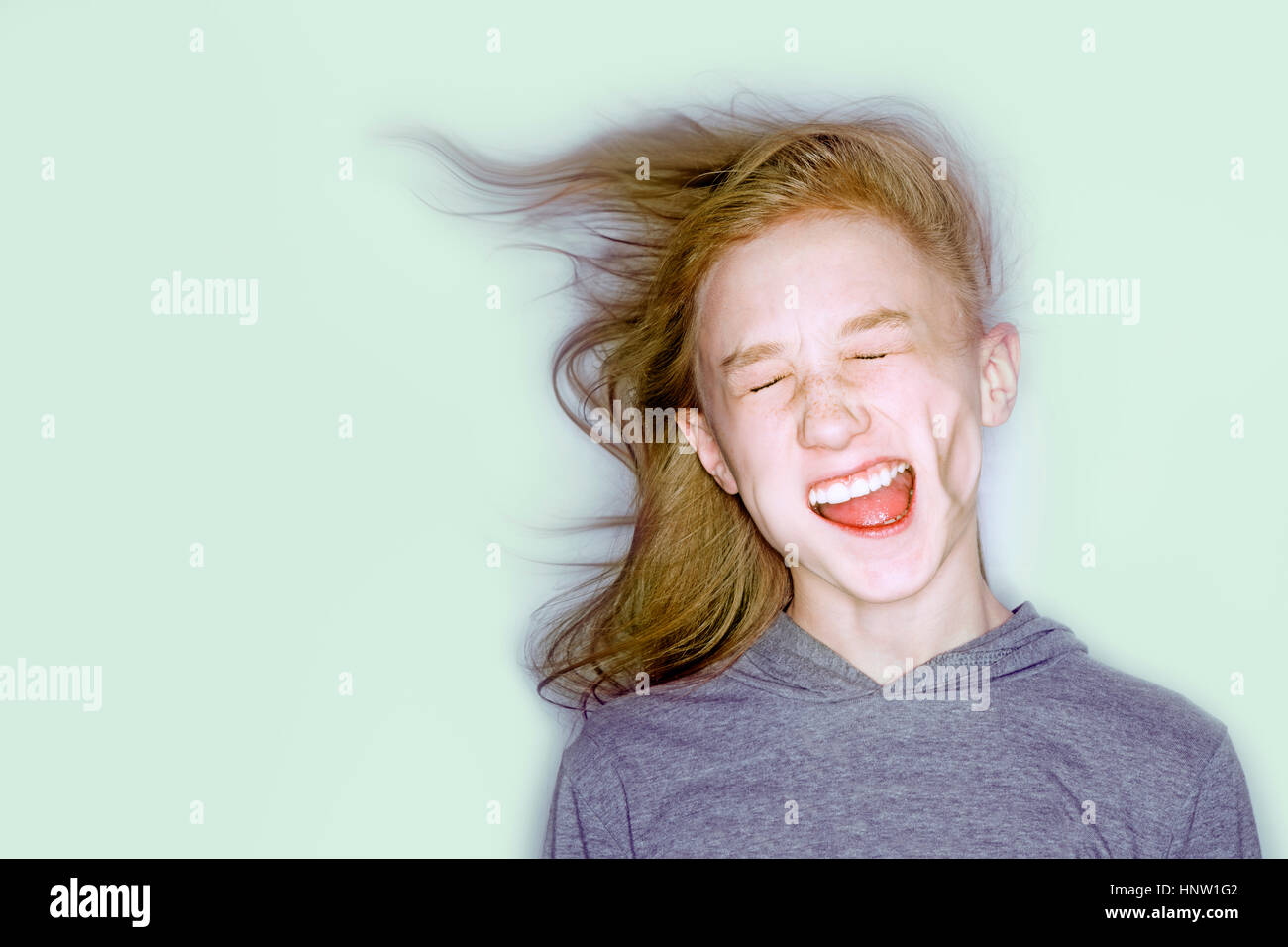 Wind blowing face of Caucasian girl Stock Photo - Alamy