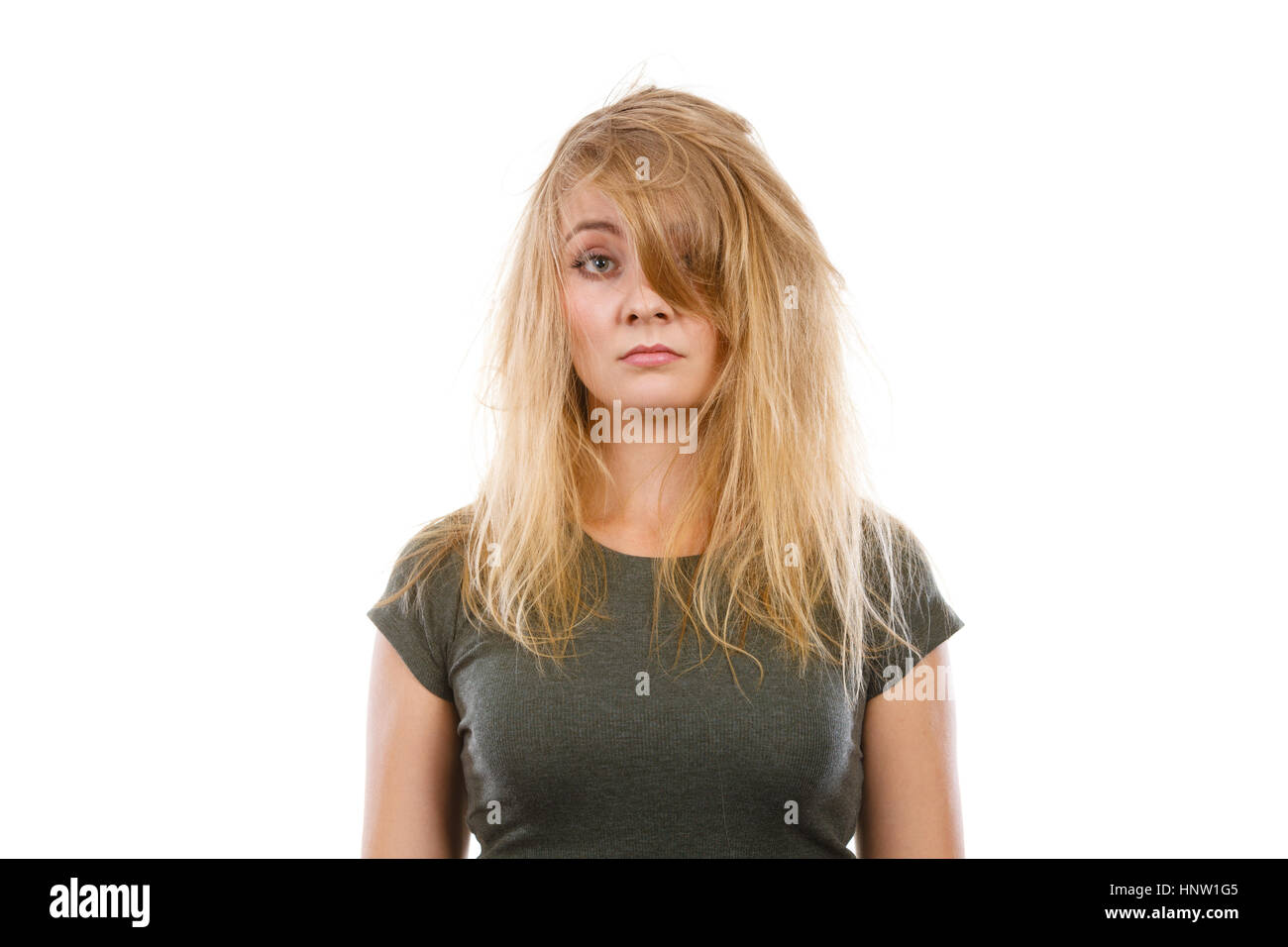 Bad hairstyle concept. Sad blonde woman with messy hair looking tired ...