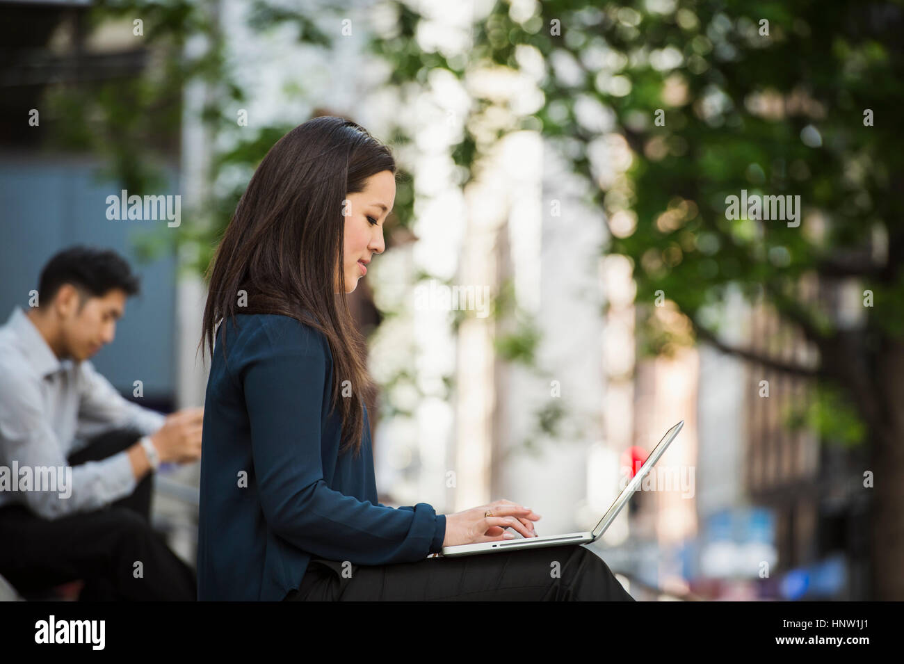 Businesswoman typing on laptop hi-res stock photography and images - Alamy