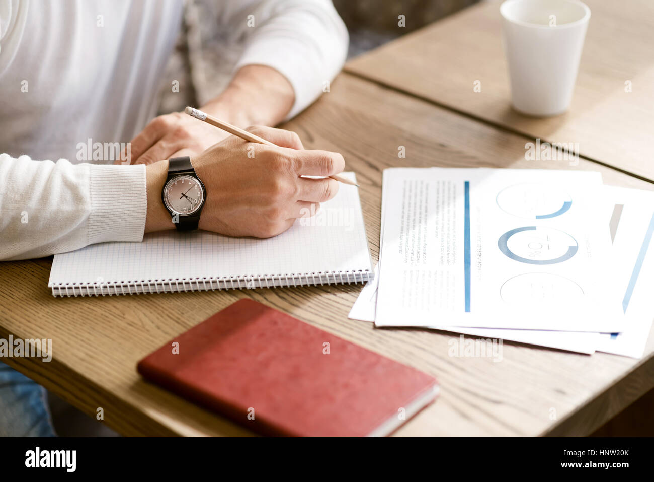 Diligent businessman talking notes in the cafe Stock Photo - Alamy