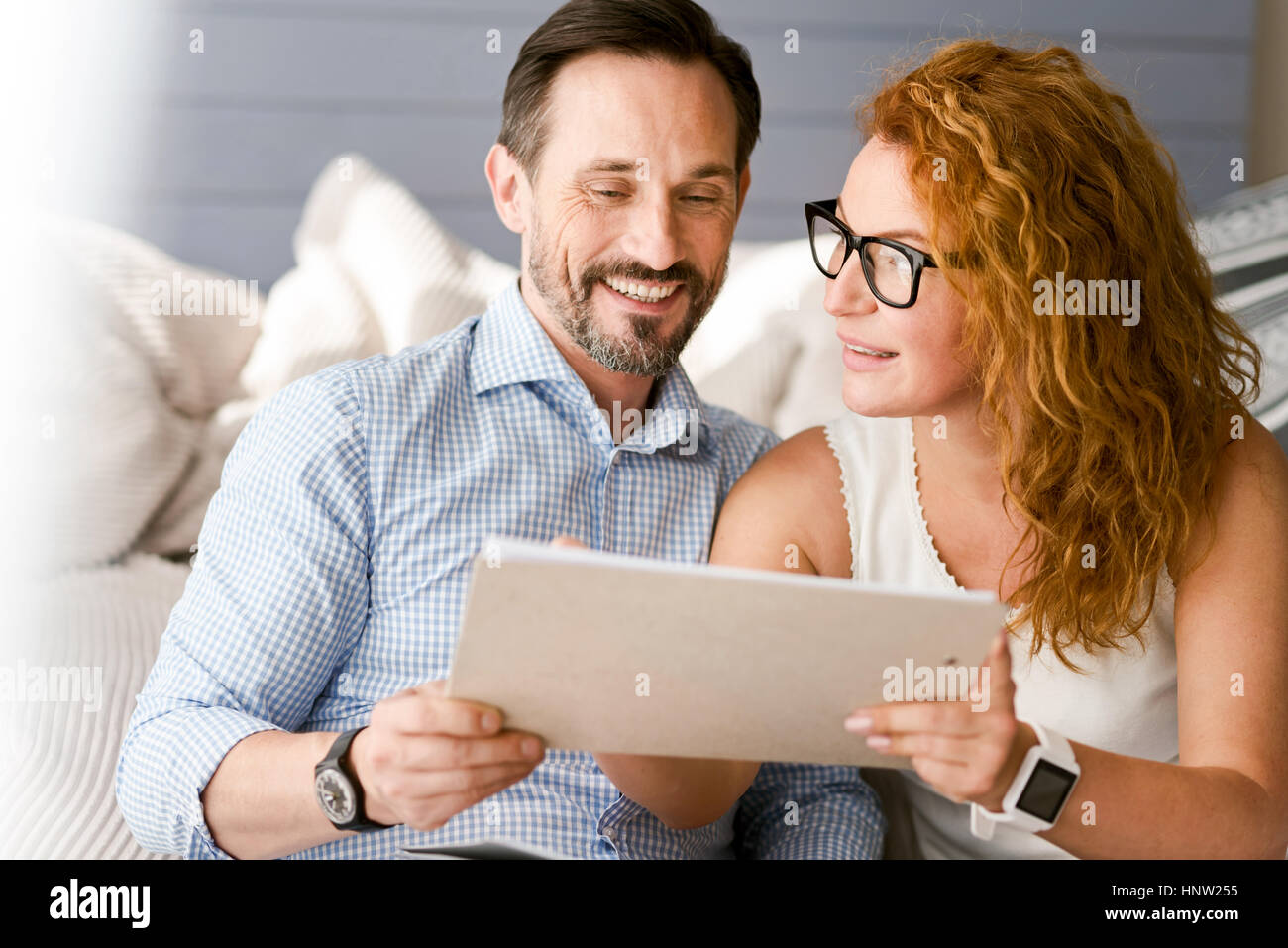 Lively couple having conversation at home Stock Photo - Alamy