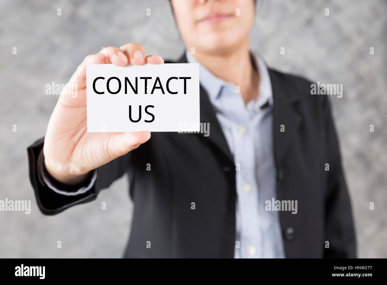 businessman showing business card with word contact us Stock Photo - Alamy