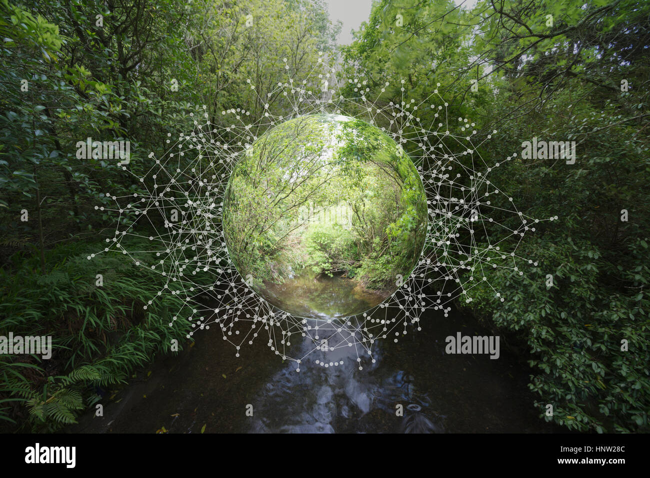 Nature sphere hovering over river in forest Stock Photo - Alamy