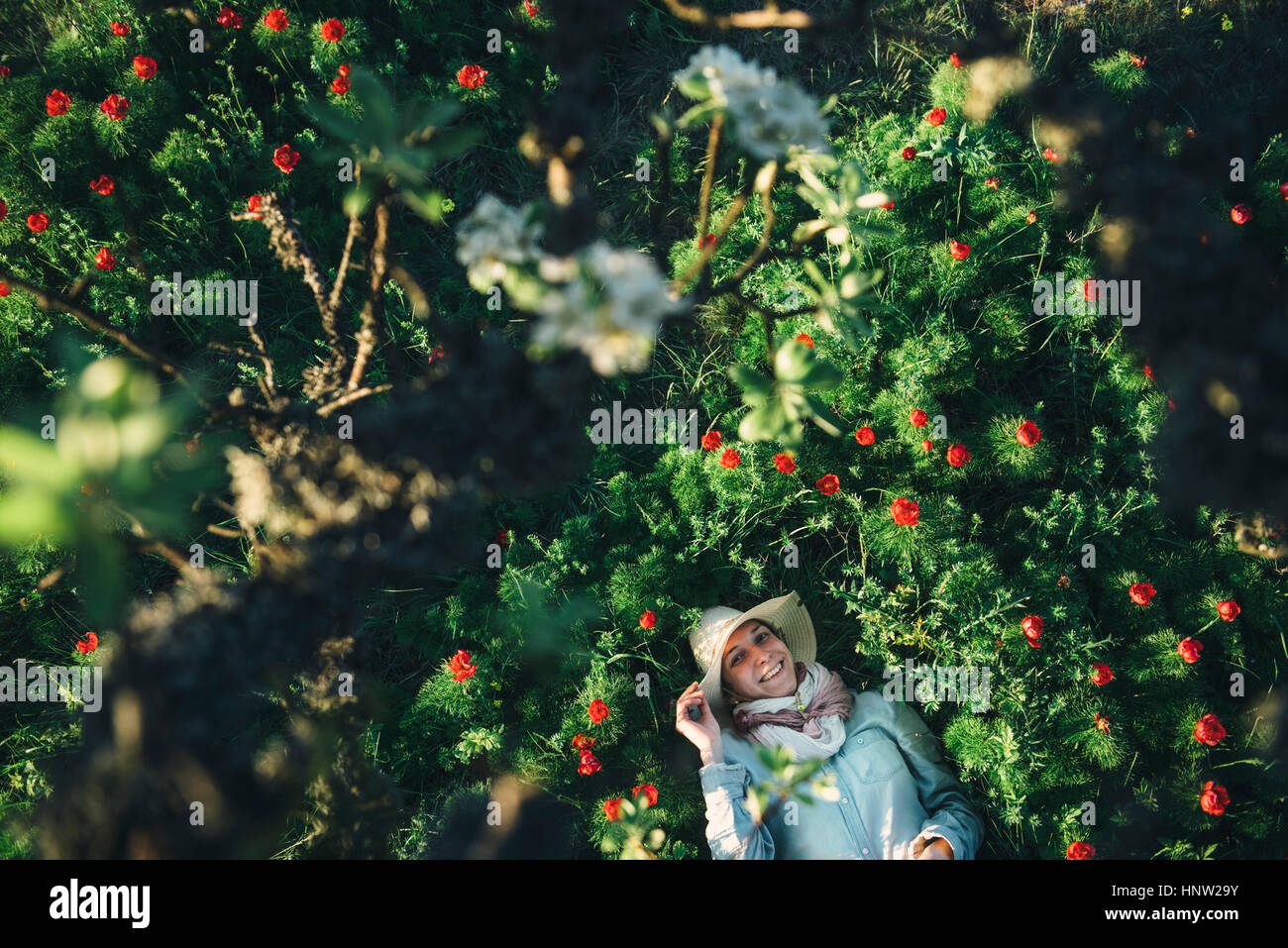 Woman laying flowers hi-res stock photography and images - Alamy