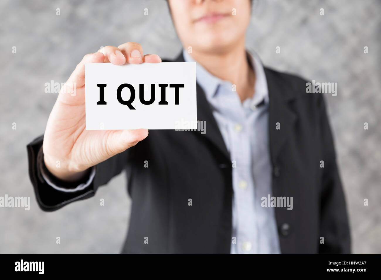 businessman showing business card with word I quit Stock Photo - Alamy