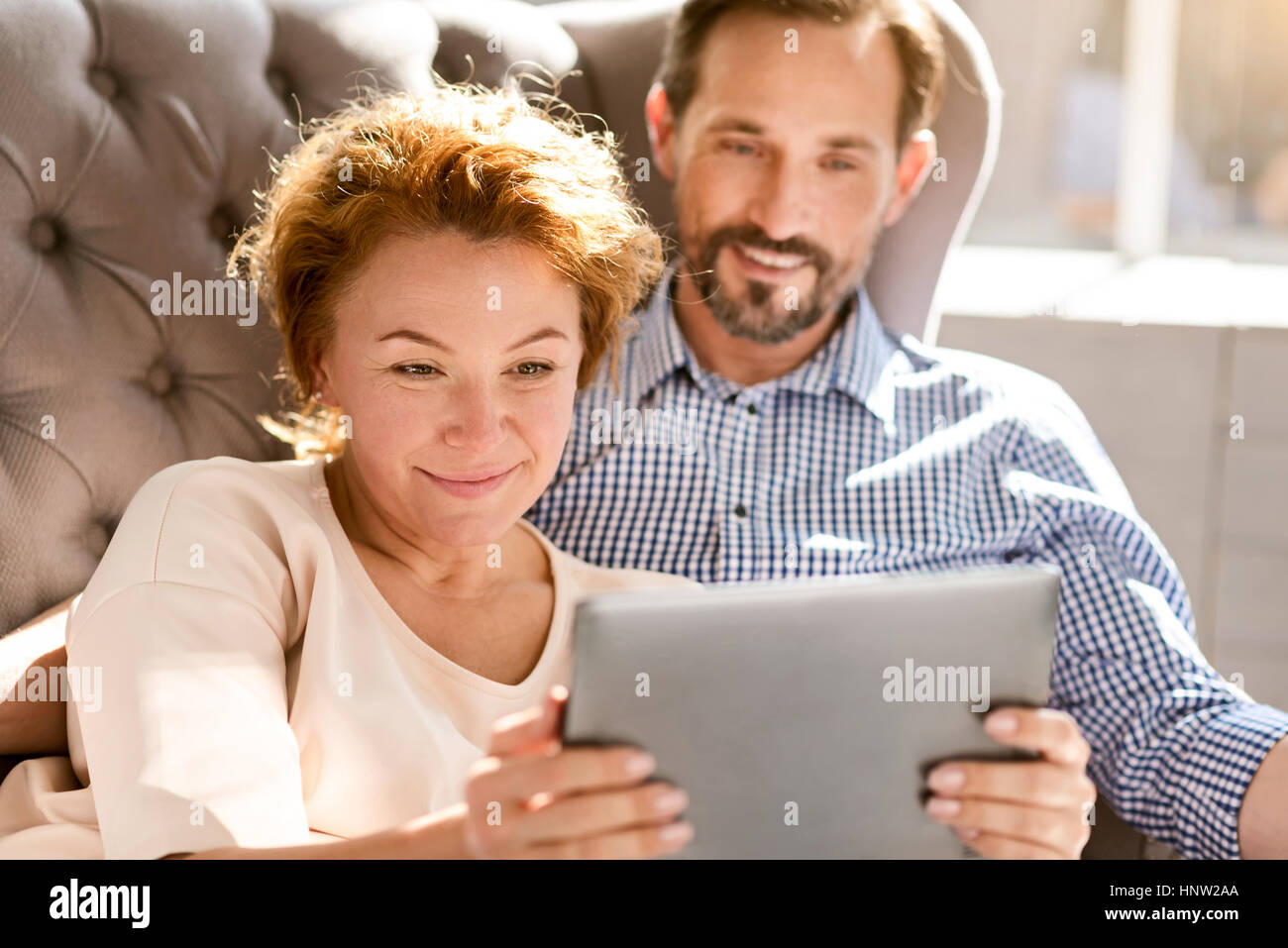 Glad middle aged couple having fun at home Stock Photo - Alamy