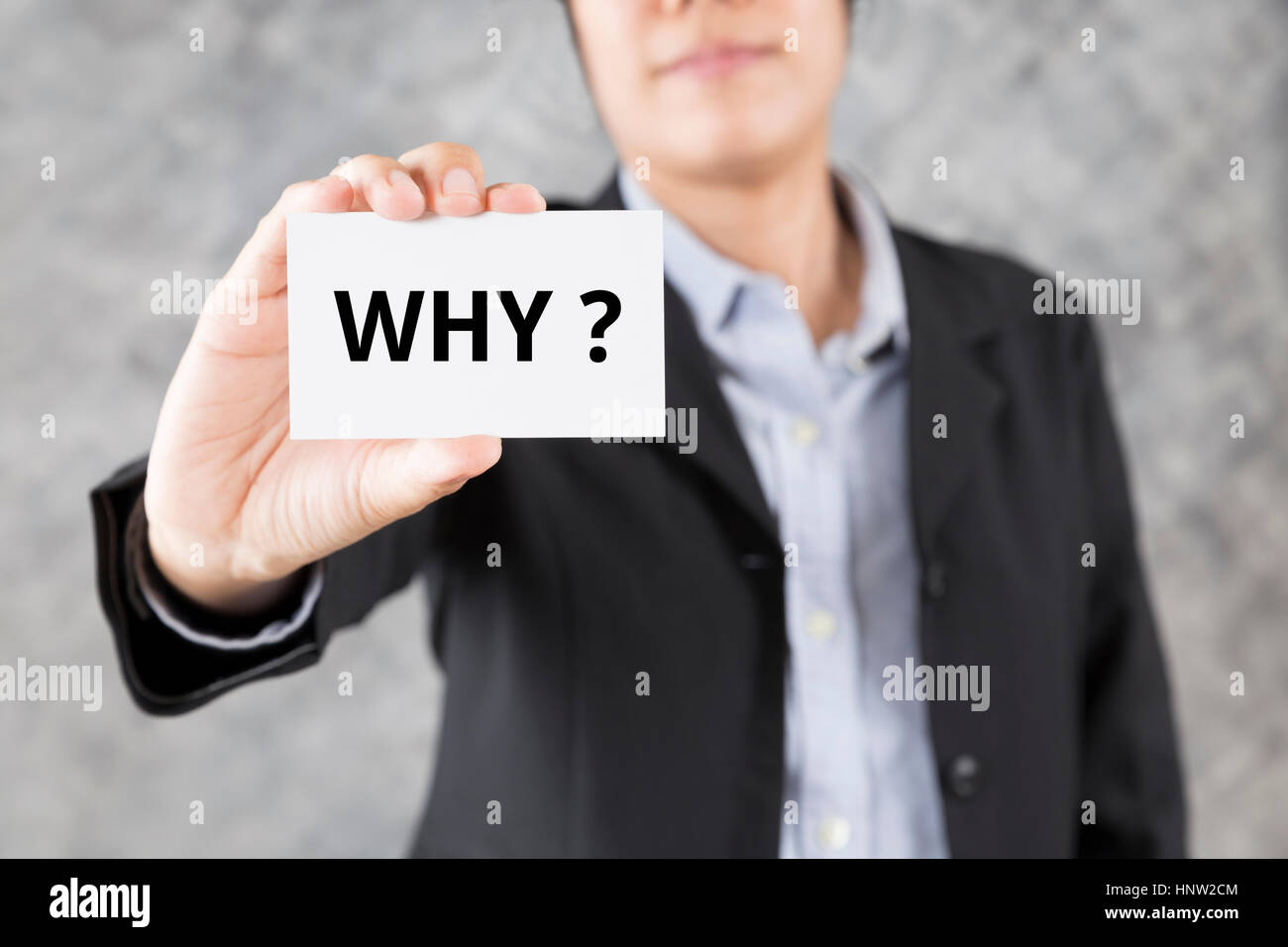 businessman showing business card with word why Stock Photo - Alamy