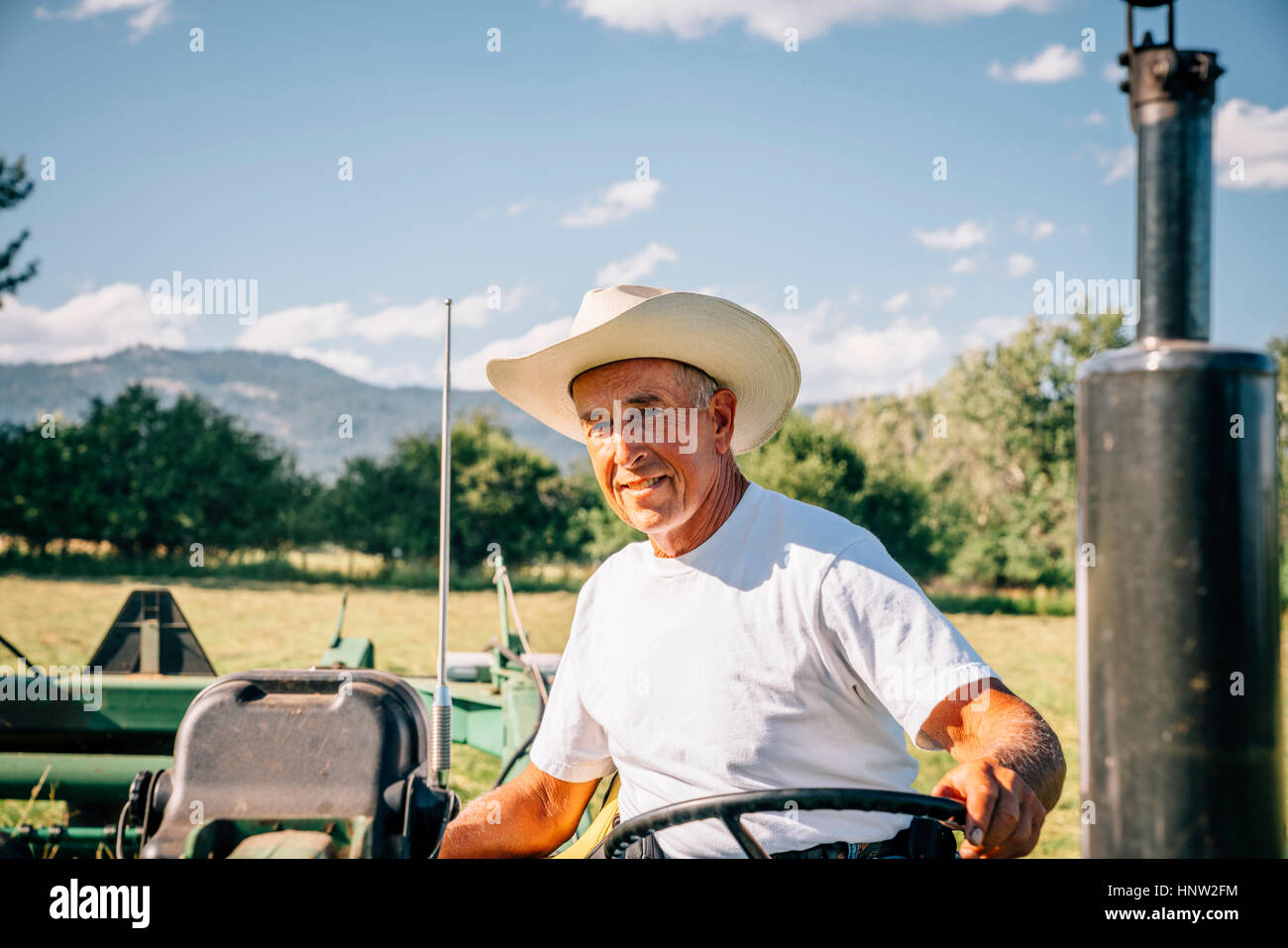 Farmer posing with tractor hi-res stock photography and images - Alamy