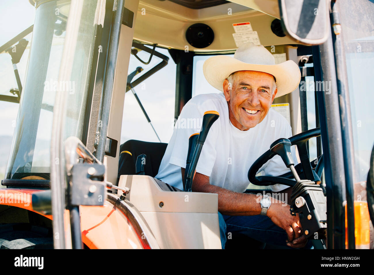Farmer posing with tractor hi-res stock photography and images - Alamy