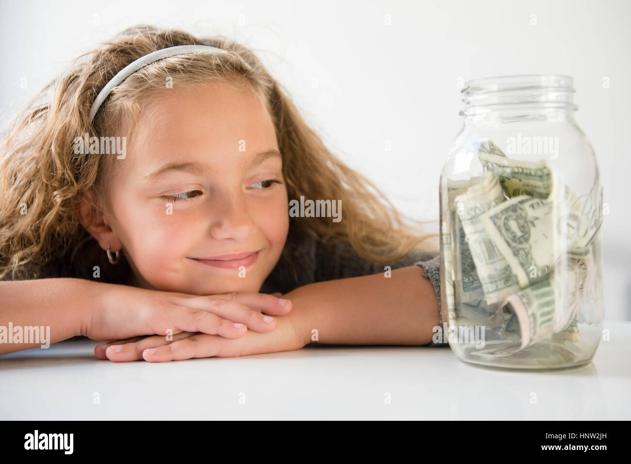 Child money jar hi-res stock photography and images - Alamy