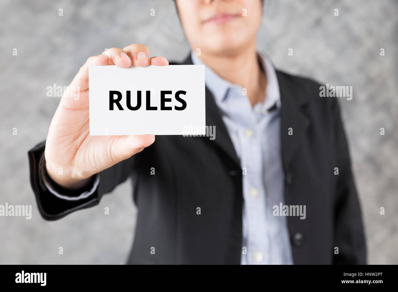 businessman showing business card with word rules Stock Photo - Alamy