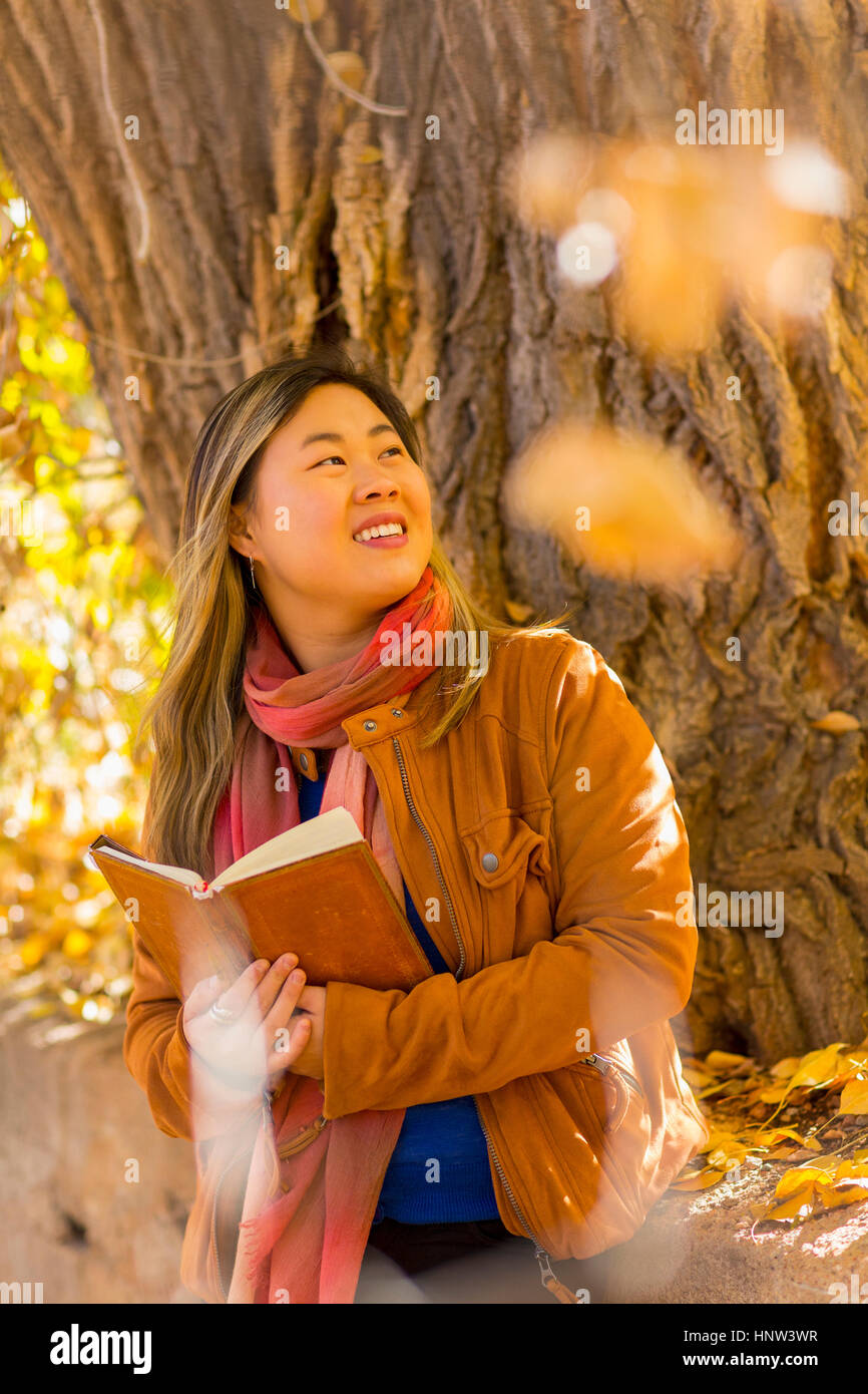 Asian woman reading book hi-res stock photography and images - Alamy