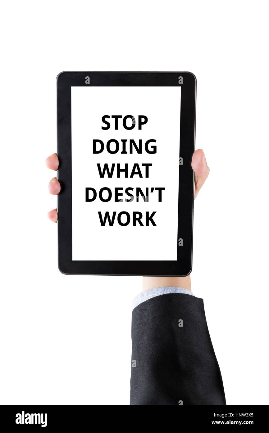 hand of businessman holding digital tablet with word stop doing what ...