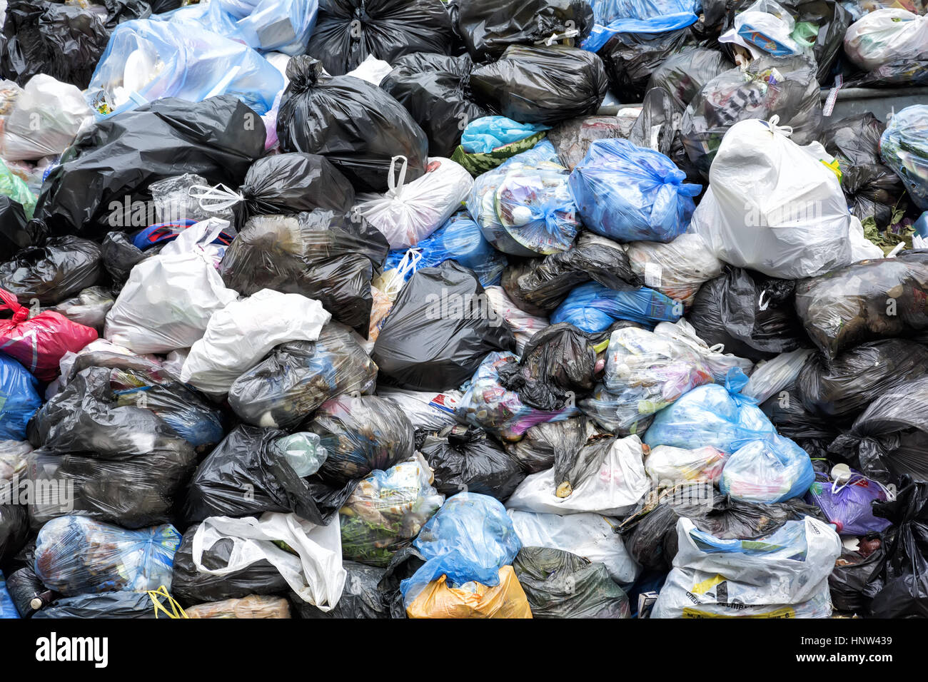 Dumpsters being full with heap of garbage overflowing Stock Photo - Alamy