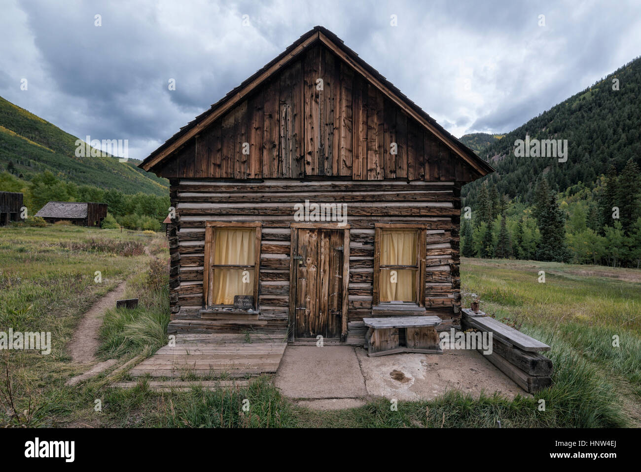 Rustic log cabin in valley Stock Photo - Alamy