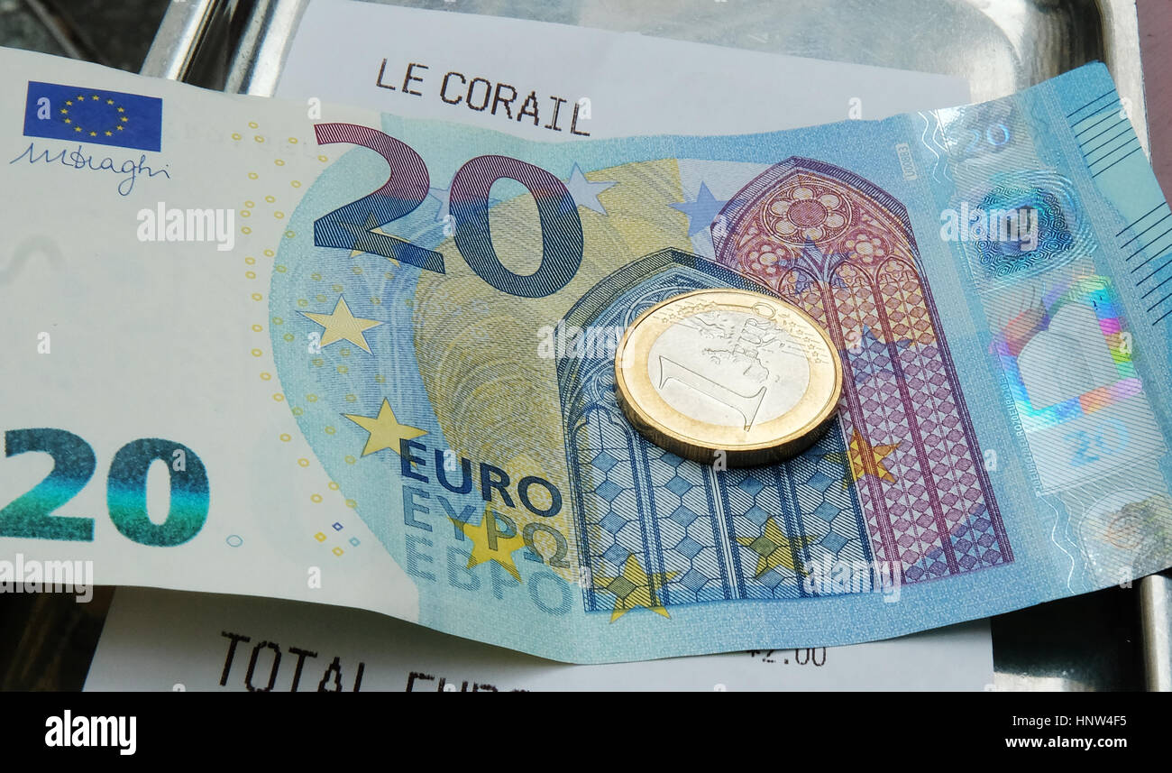 A bill paid with euro bank notes and coins in a Paris cafe Stock Photo ...
