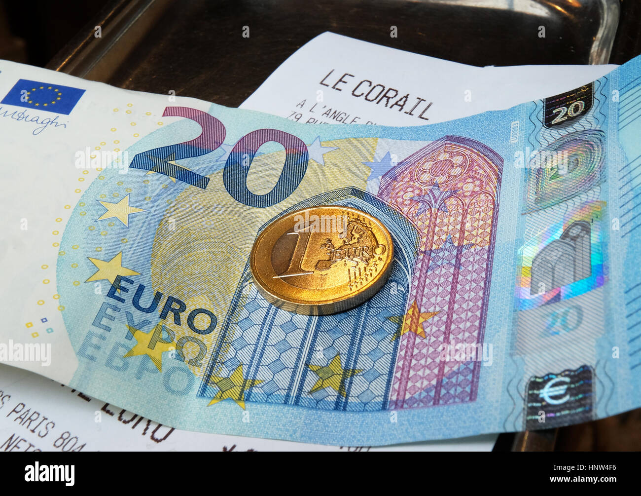 A bill paid with euro bank notes and coins in a Paris cafe Stock Photo ...