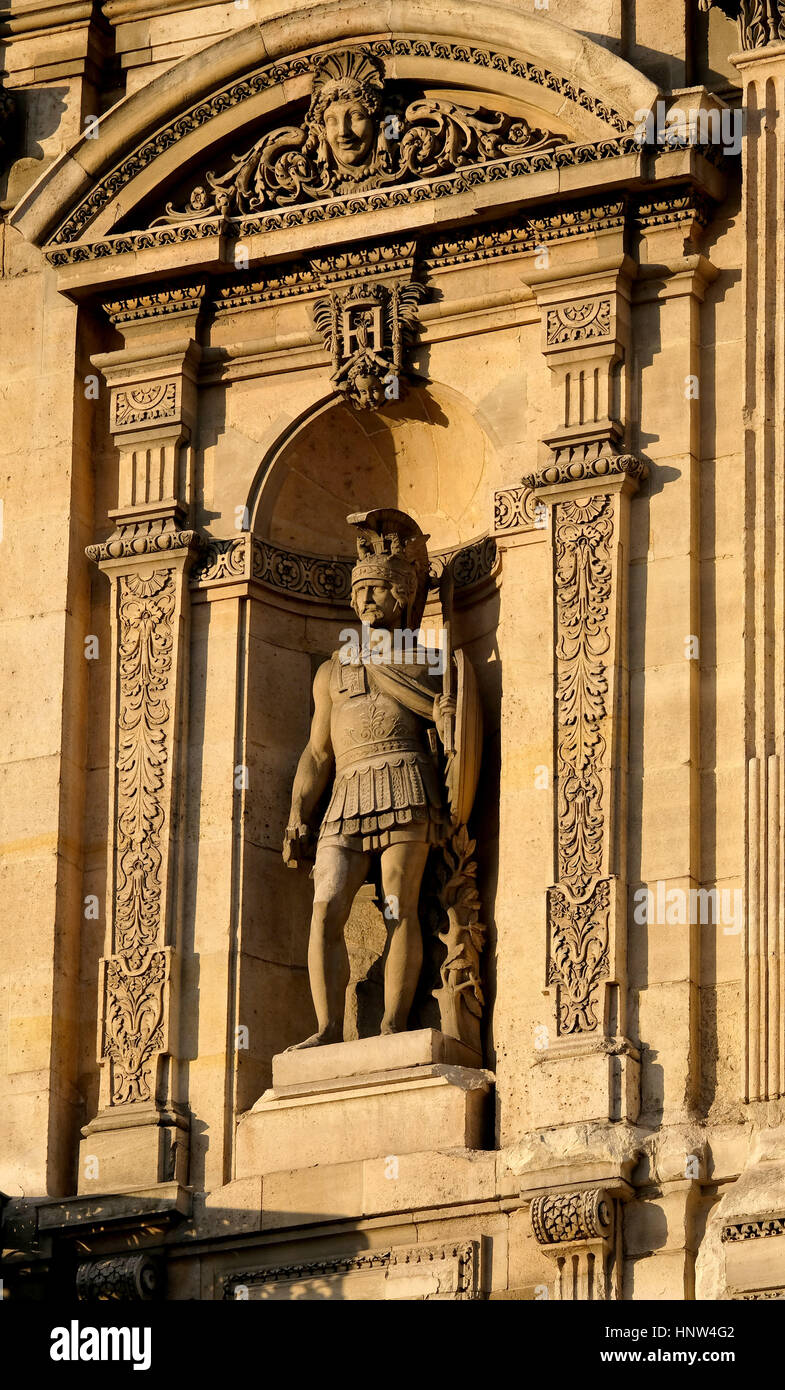Louvre Museum, Paris: A roman figure sculpted in stone decorates the ...