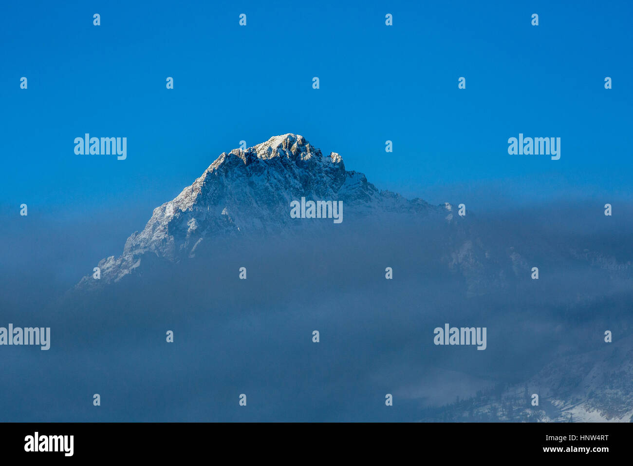 Mountain peak above clouds Stock Photo - Alamy