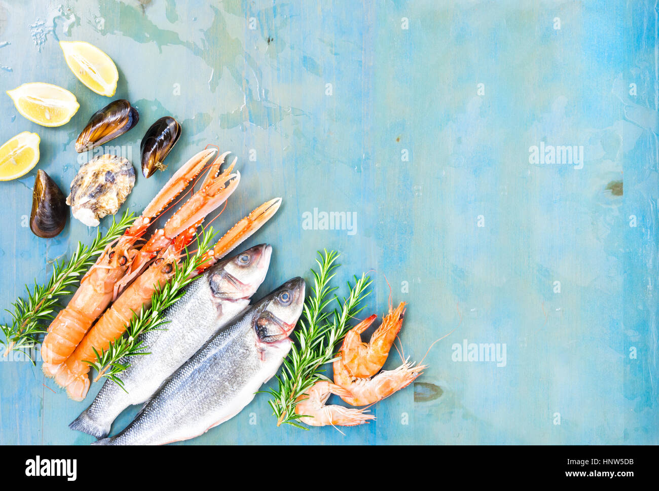 Fresh seafood on blue background Stock Photo - Alamy