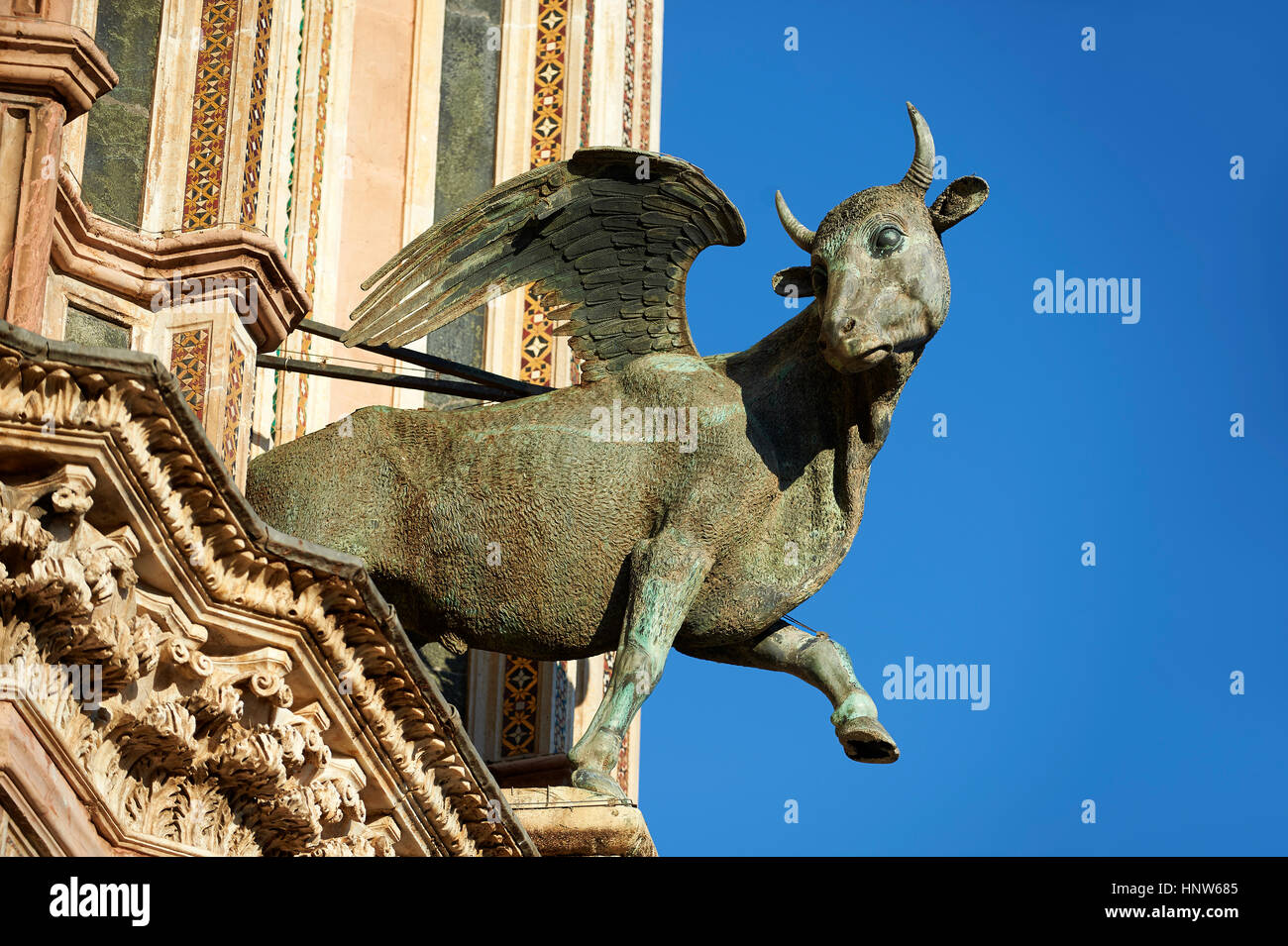 Bronze statue of a winged ox representing the the Evangelist Luke ...