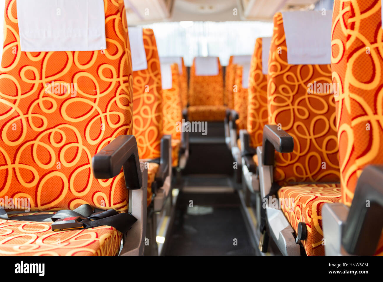 orange fabric vehicle seat in interior mini bus Stock Photo - Alamy