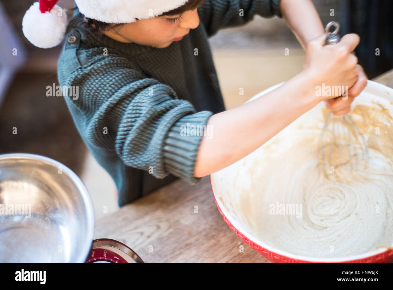 Boy mixing batter in bowl Stock Photo - Alamy