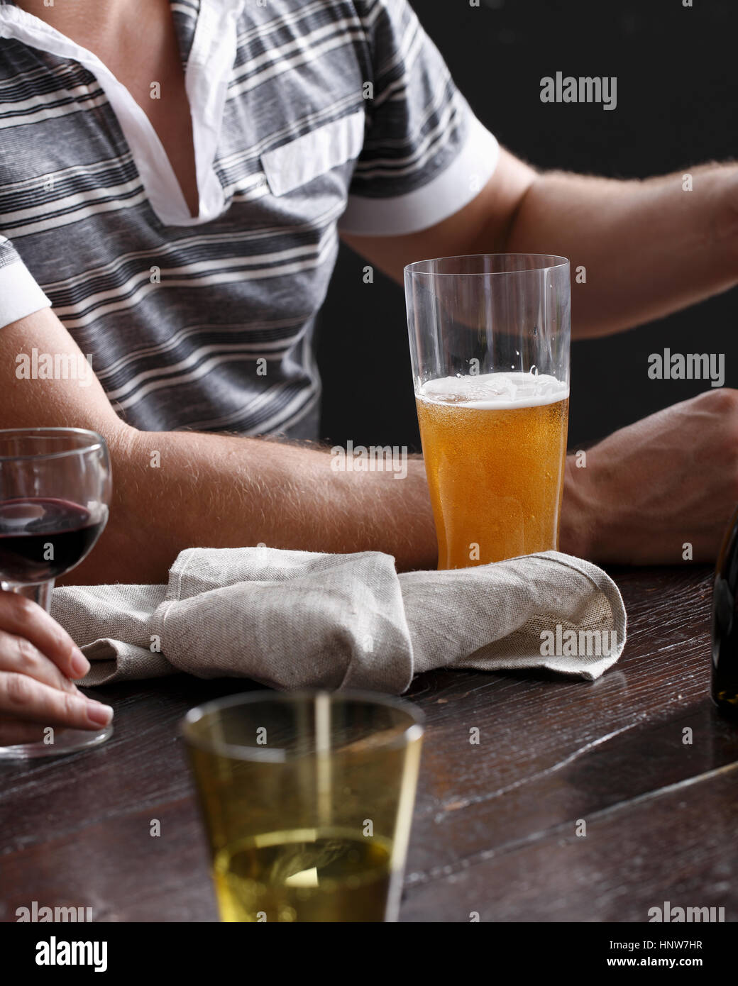 Two people drinking drinks in restaurant, mid section, close-up Stock ...