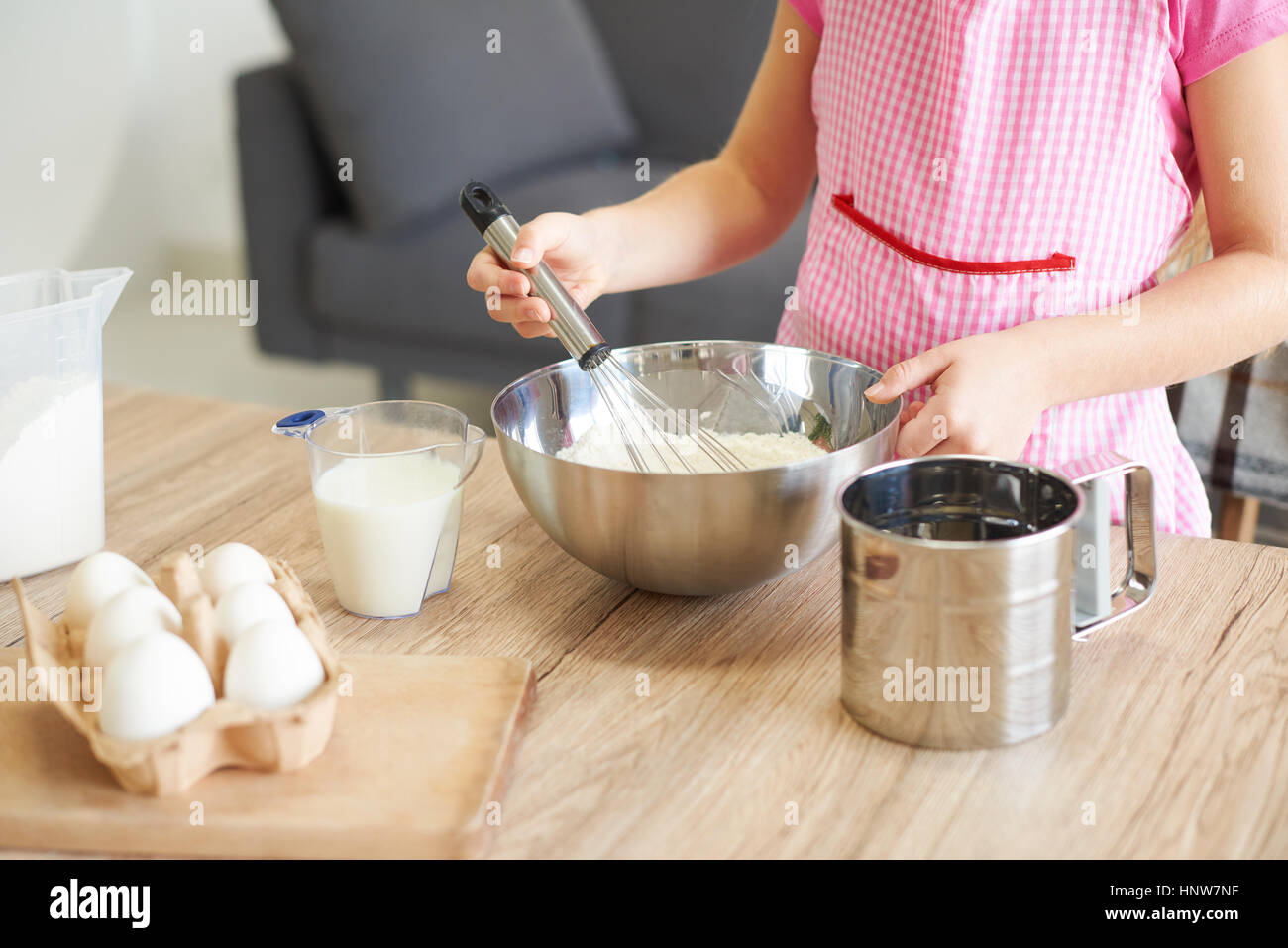 Children mixing ingredients together home hi-res stock photography and ...