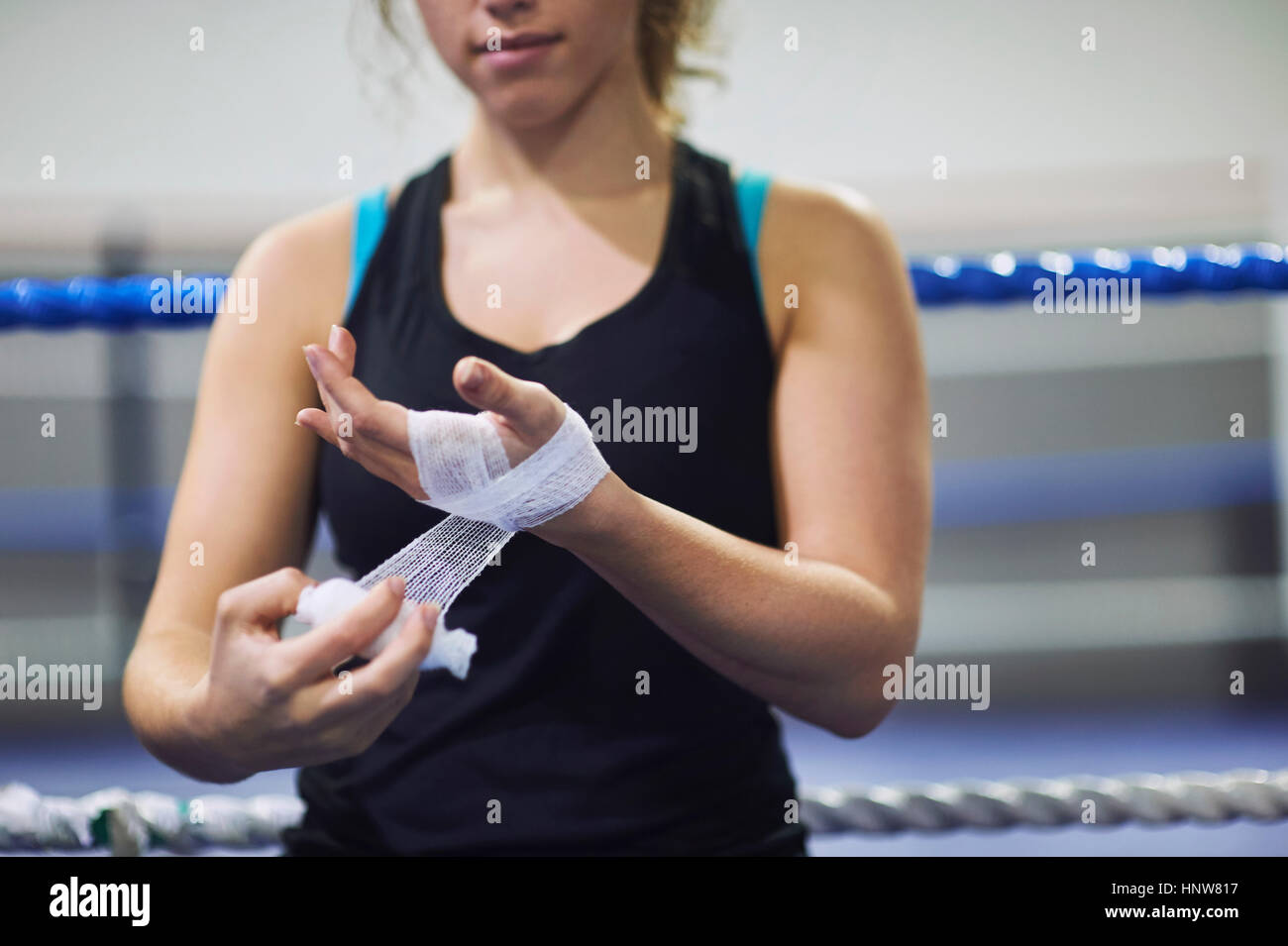 Cropped shot of young female boxer bandaging hands Stock Photo - Alamy