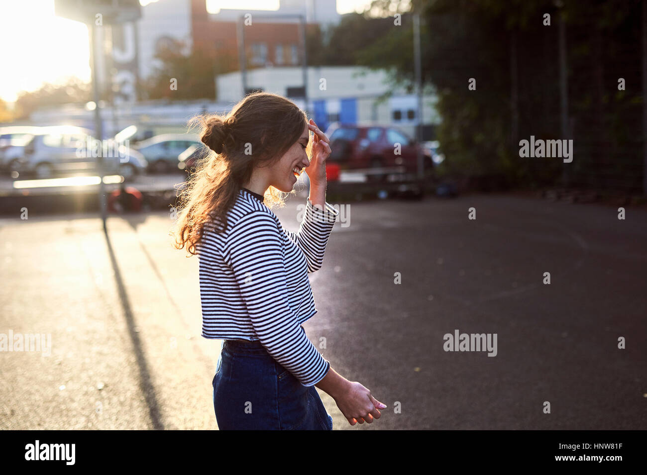 Young woman street side view hi-res stock photography and images - Alamy