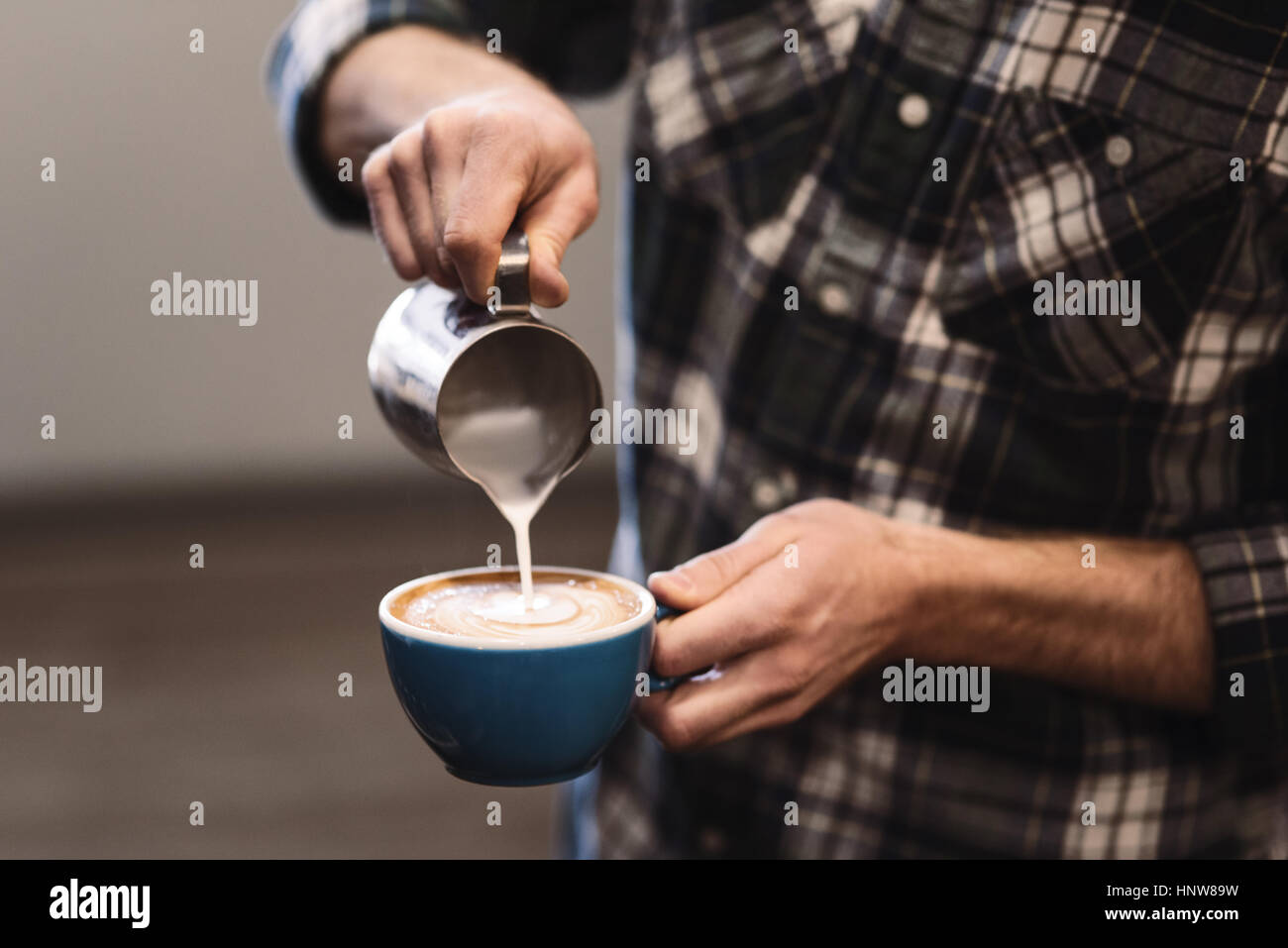 Barista preparing coffee in cafe Stock Photo - Alamy