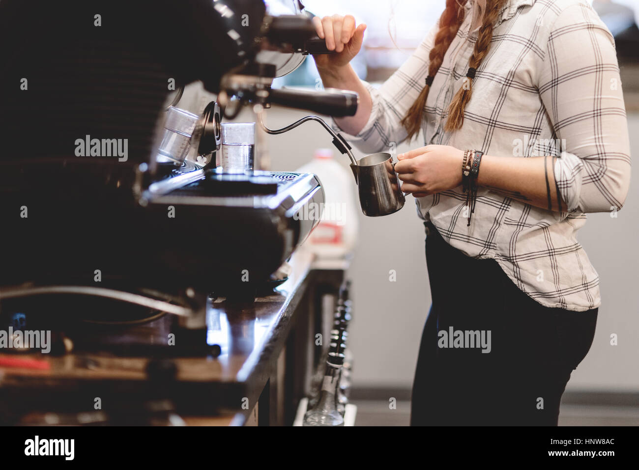 Barista preparing coffee in cafe Stock Photo - Alamy