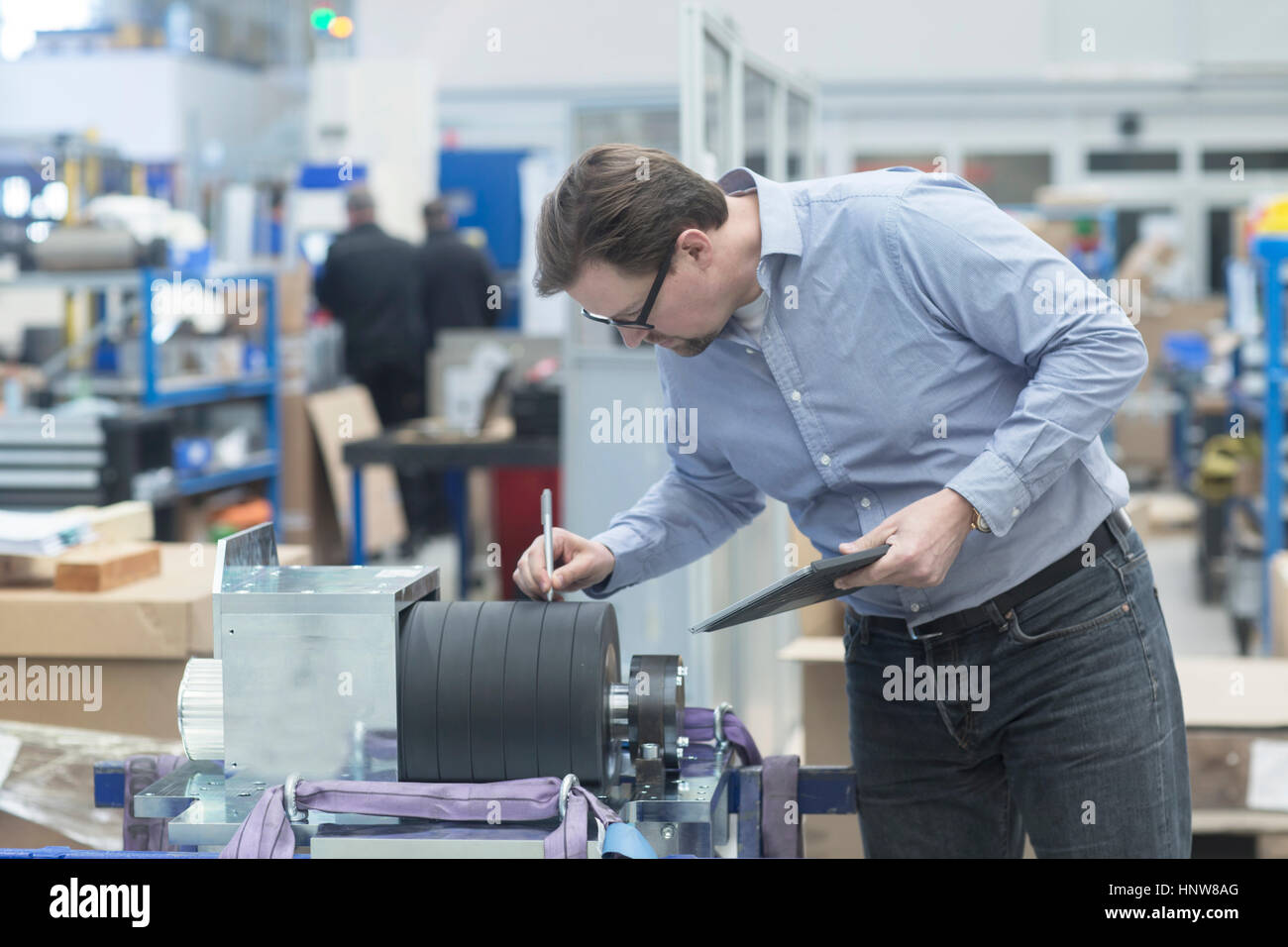 Engineer working in industrial plant Stock Photo - Alamy