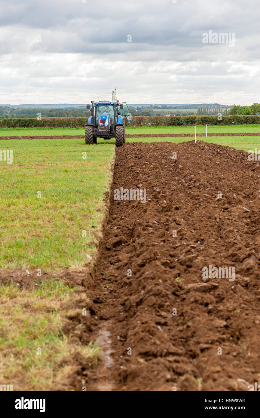Tractor ploughing at a ploughing match at Cliffe near gravesned Kent ...