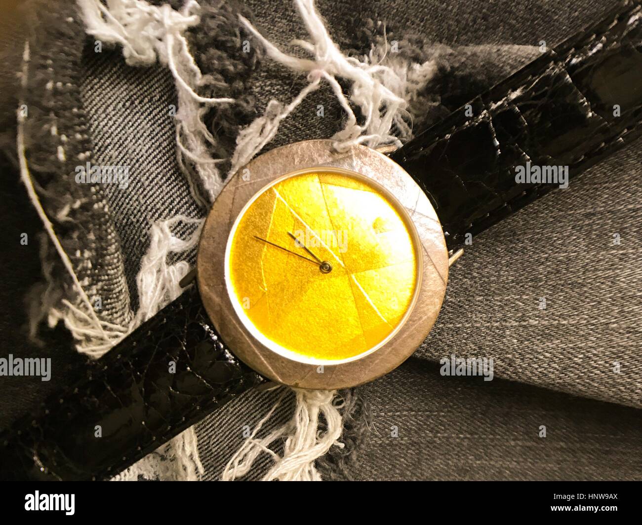 Round vintage watch on denim Stock Photo - Alamy