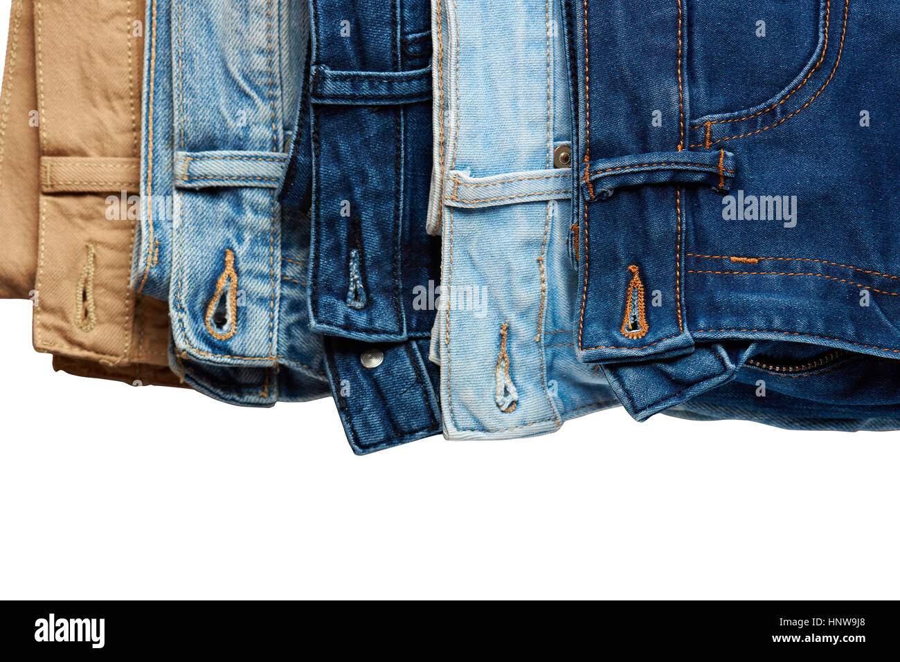 Stack of blue jeans isolated on white background Stock Photo - Alamy