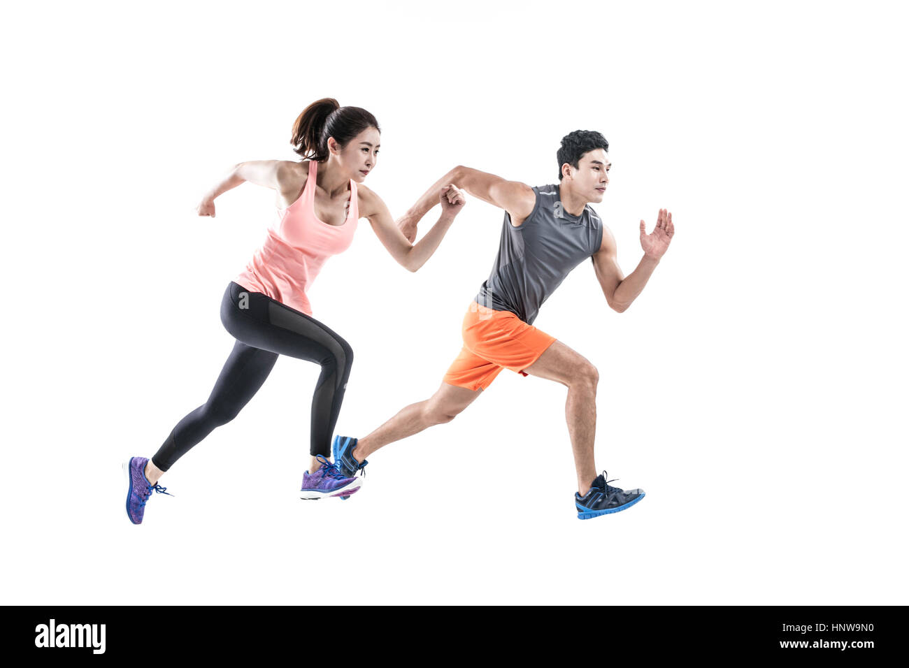 Man and woman running Stock Photo - Alamy