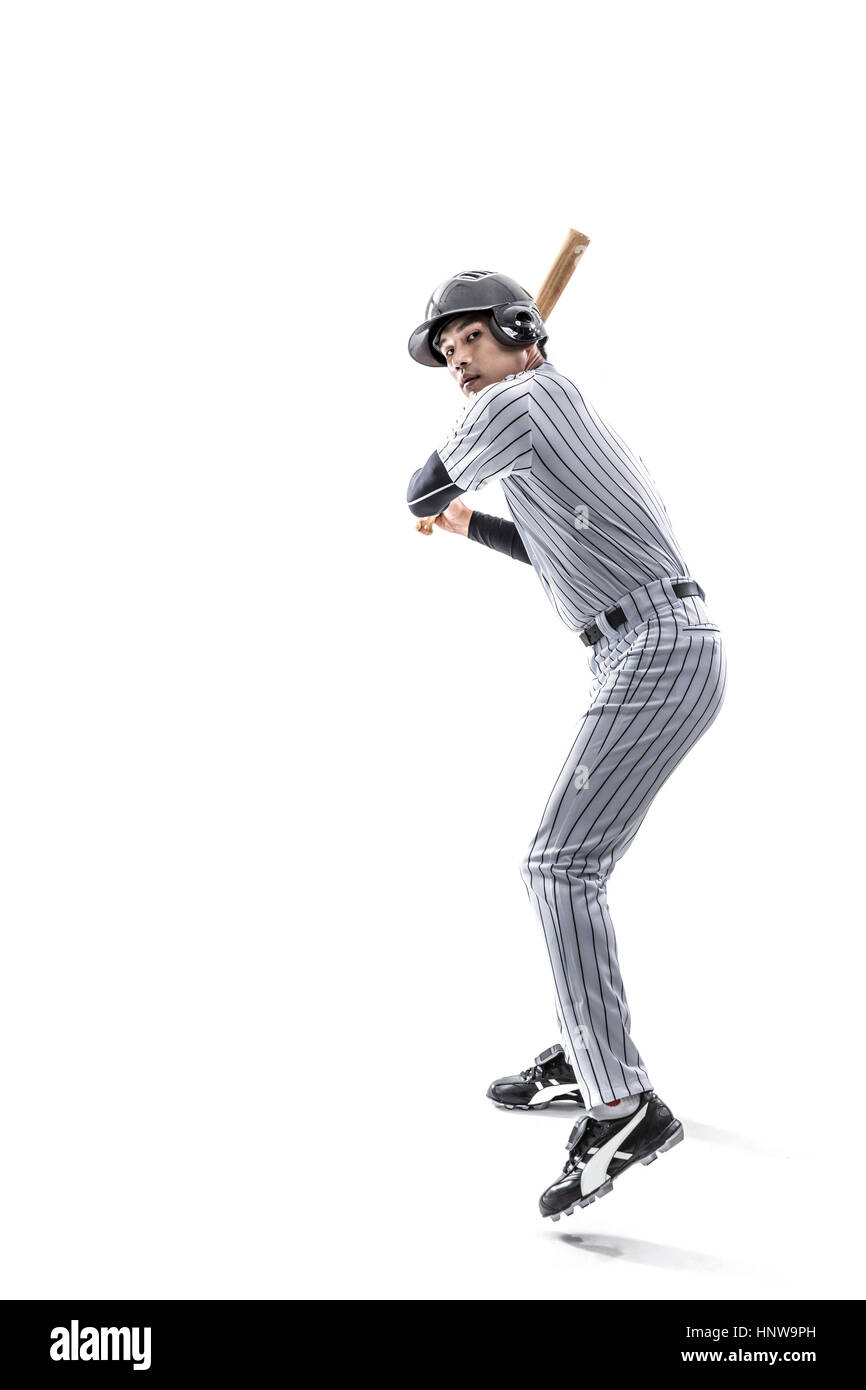 Baseball player with a bat posing Stock Photo - Alamy