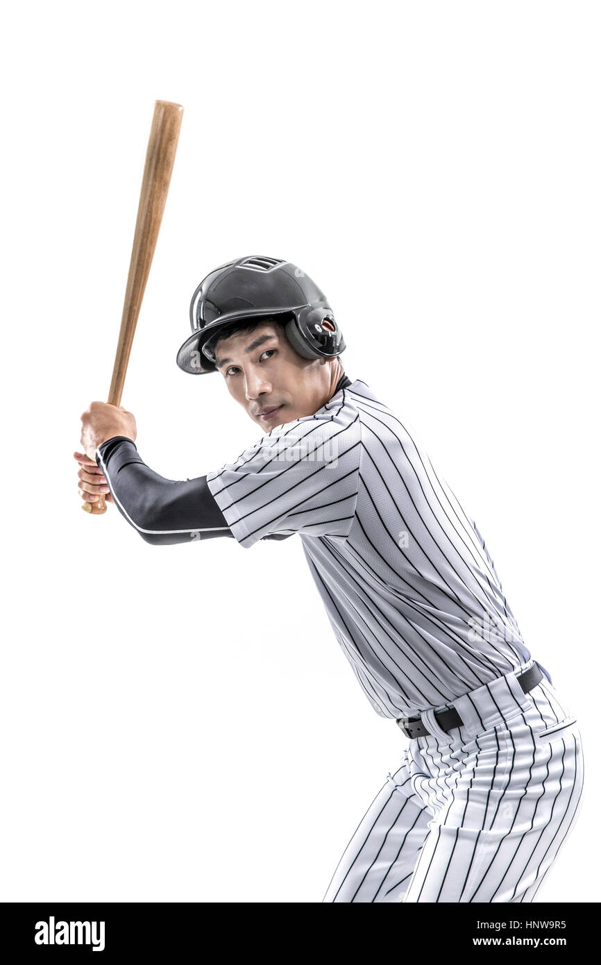 Baseball player with a bat posing Stock Photo - Alamy